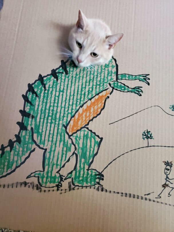 28 Claw-Some Photos Of Cardboard Box Cat Dinosaurs In Their Natural Habitat